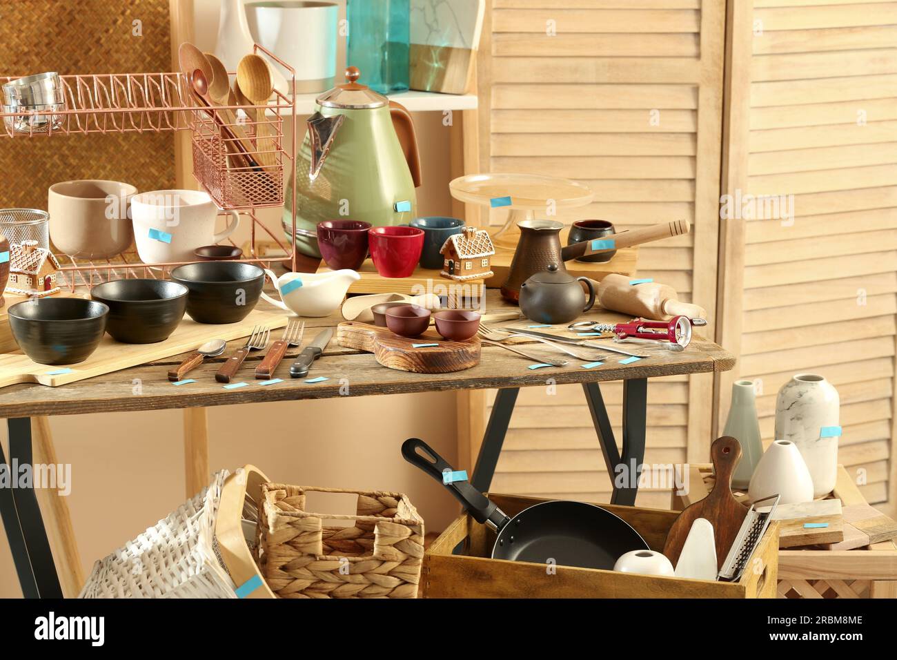 Many different cooking utensils in room. Garage sale Stock Photo - Alamy
