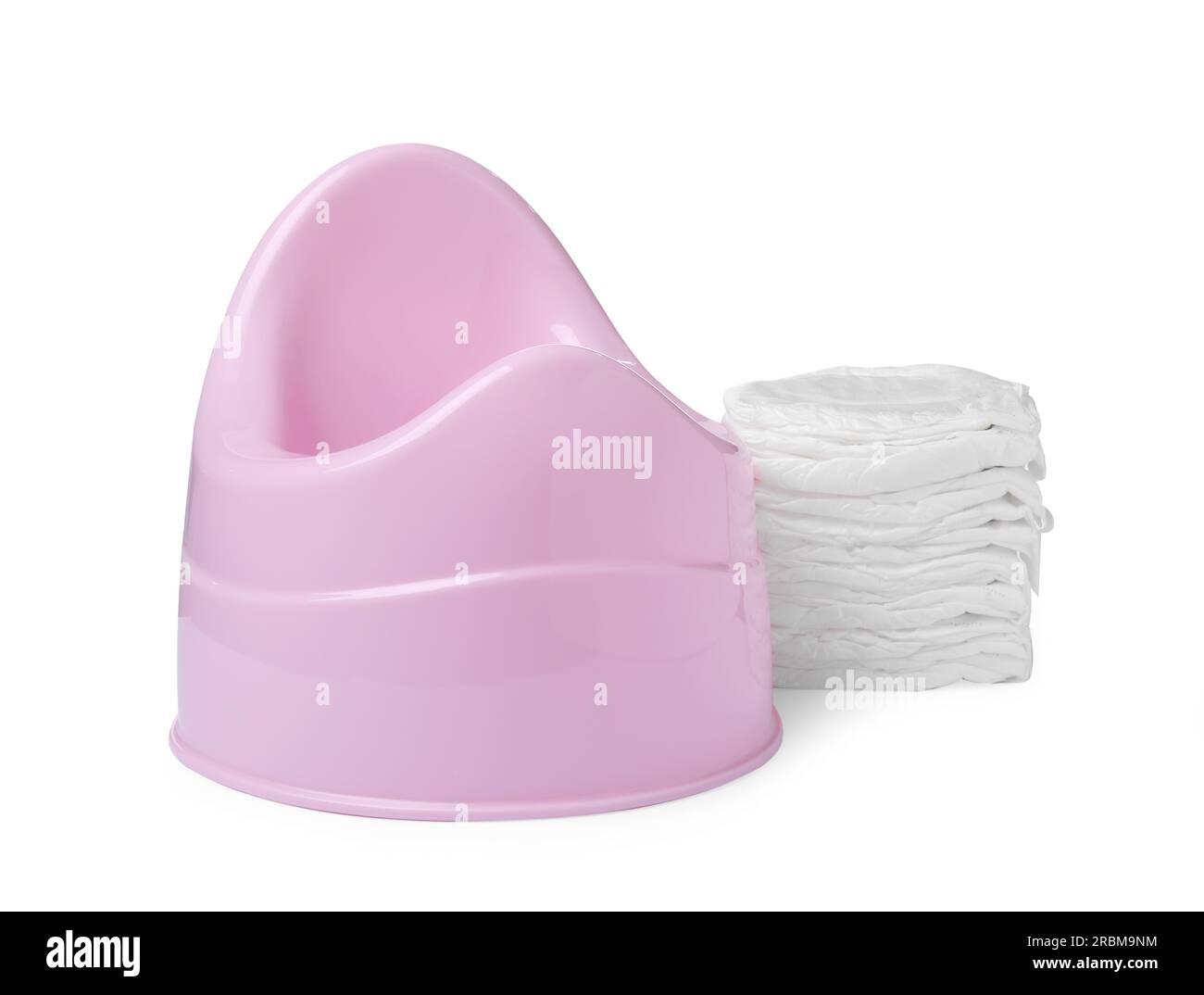 Pink baby potty and stack of diapers isolated on white. Toilet training ...