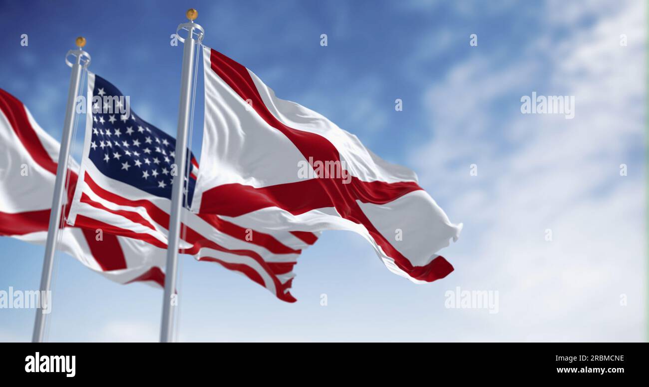 The state flags of Alabama waving with the national flag of the United ...