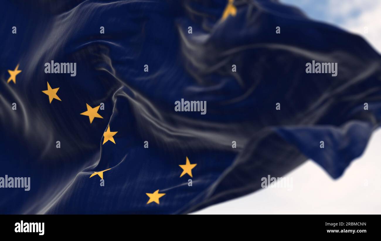 Close-up of the Alaska state flag waving. dark blue background with ...