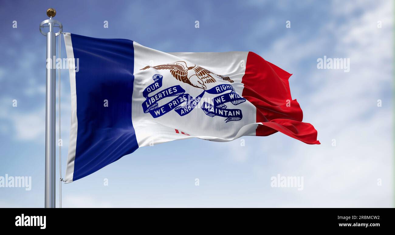 Iowa state flag waving in the wind on a clear day. Tricolor of blue ...