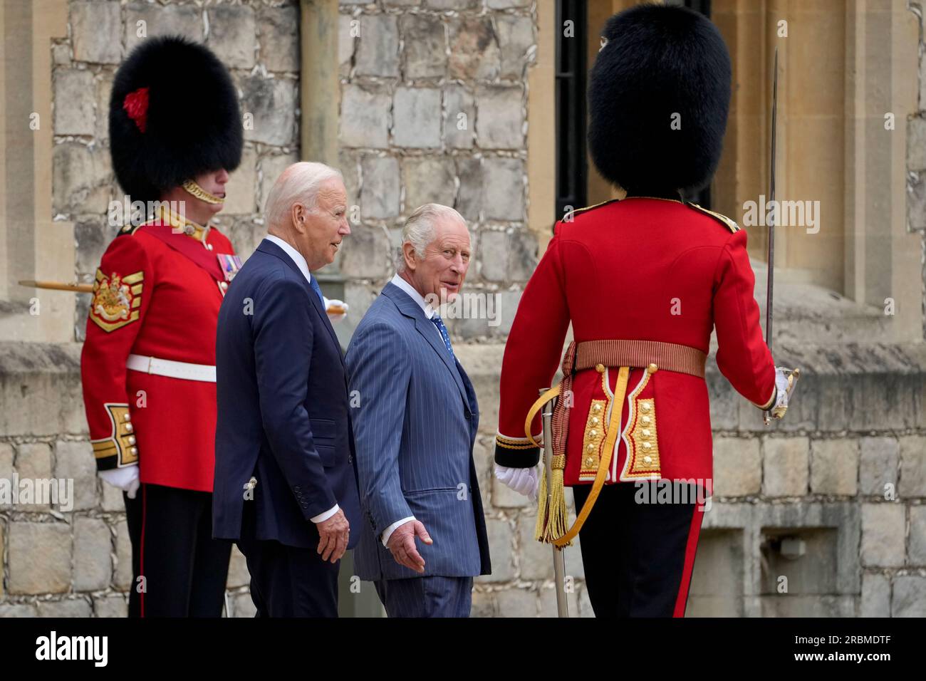 US President Joe Biden walks with Britain's King Charles III during a ...