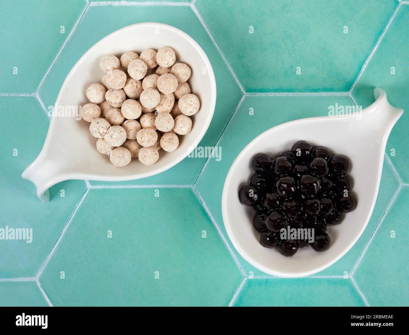 Raw and cooked tapioca balls with different flavors, also known as boba ...