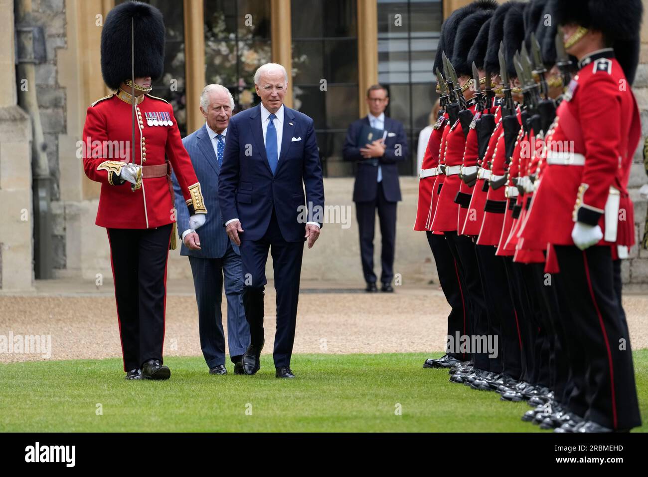 US President Joe Biden reviews royal guards along with Britain's King ...