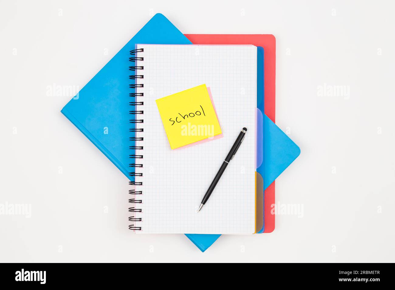 Notebooks, pen and paper reminder with the word school Stock Photo - Alamy