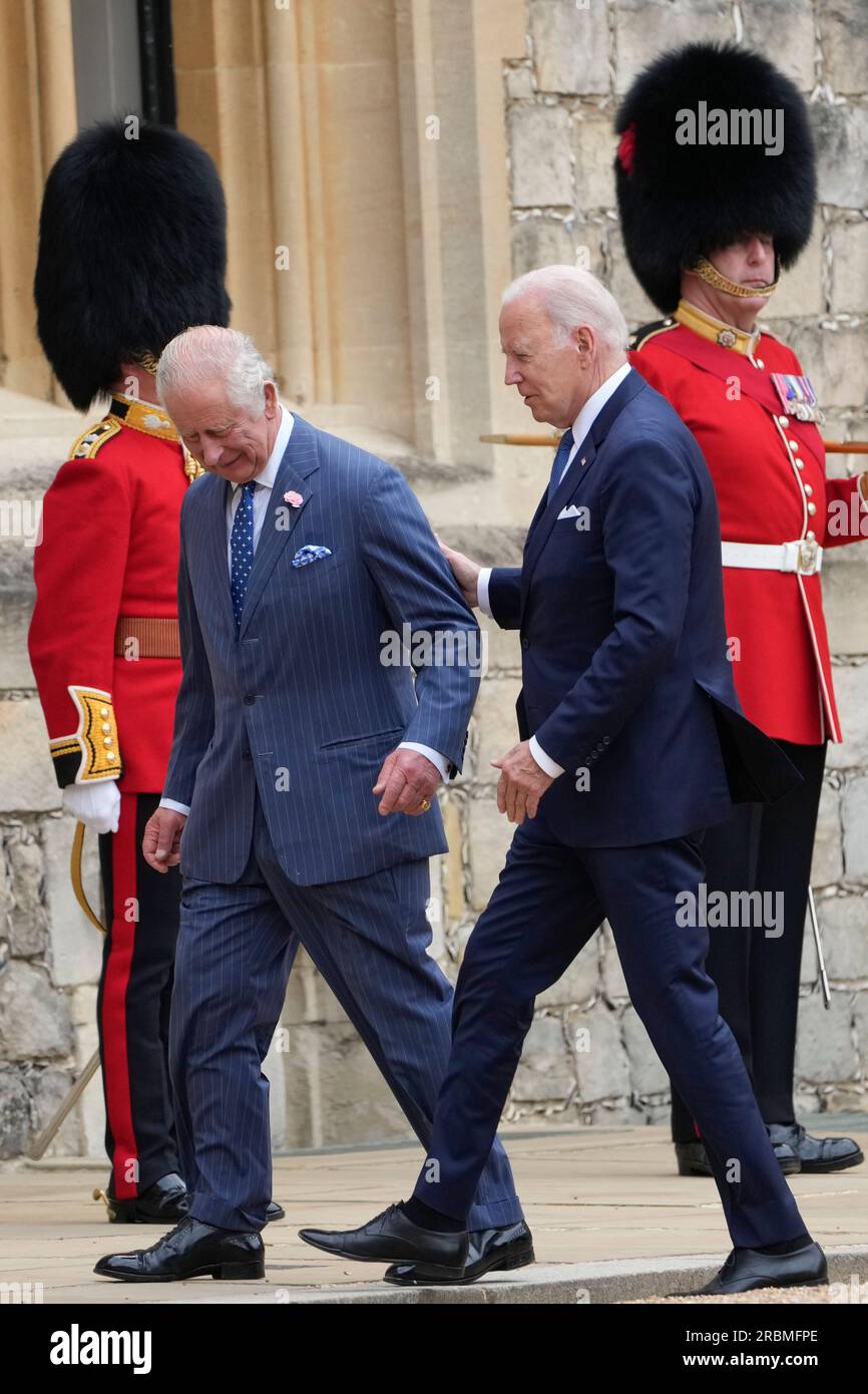 US President Joe Biden walks with Britain's King Charles III during a ...