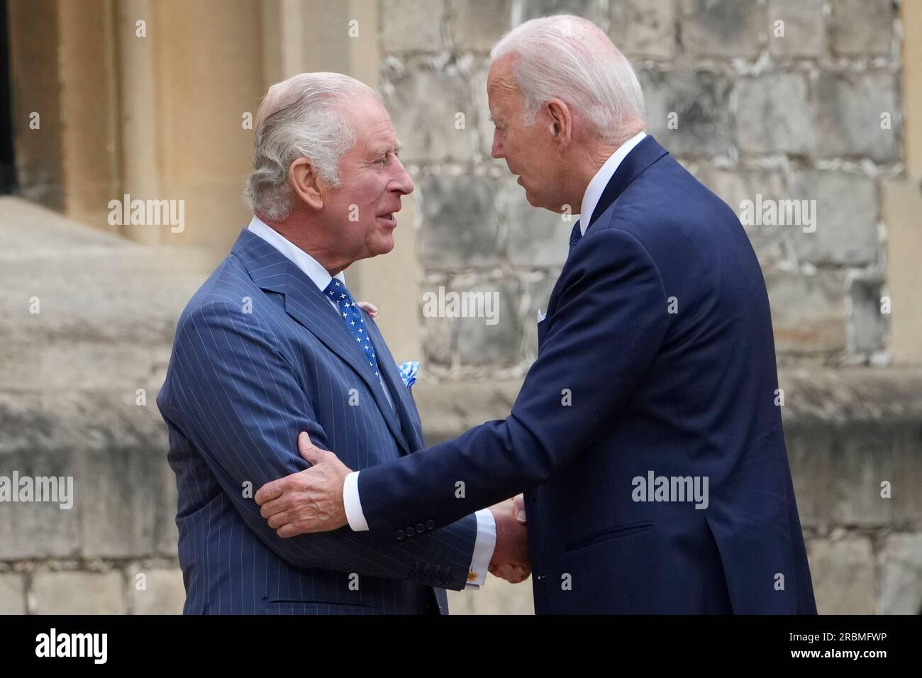 US President Joe Biden shakes hands with Britain's King Charles III ...