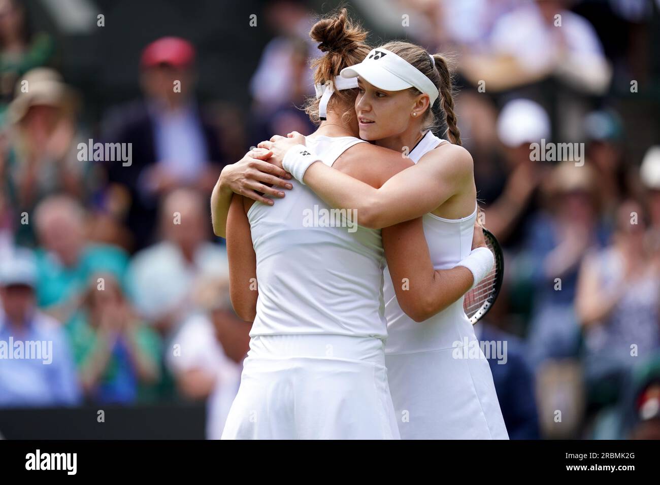 Elena Rybakina (right) consoles Beatriz Haddad Maia as she retires ...