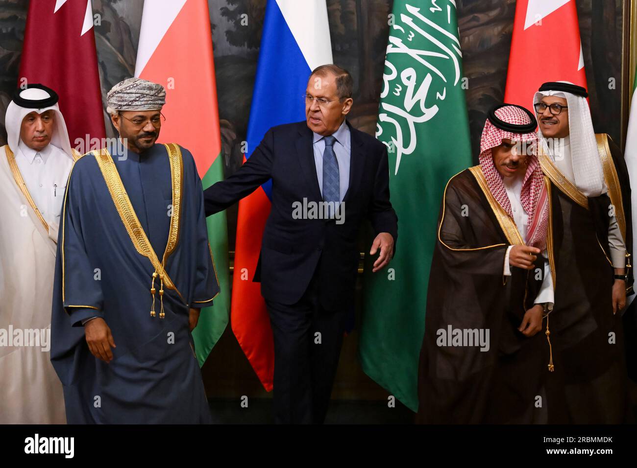 Russian Foreign Minister Sergei Lavrov, centre, walks with his ...