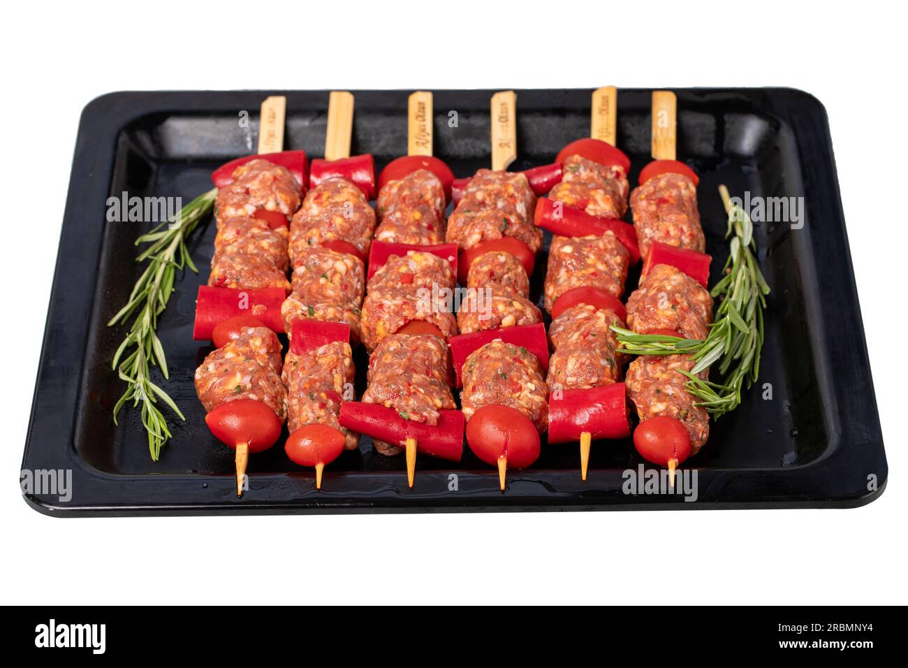 Kebab with vegetables and minced meat. Shish kebab with raw minced meat ...