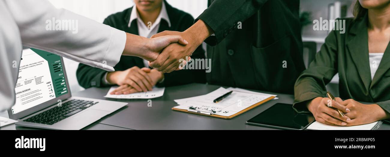 Interviewer handshaking the applicant hi-res stock photography and ...