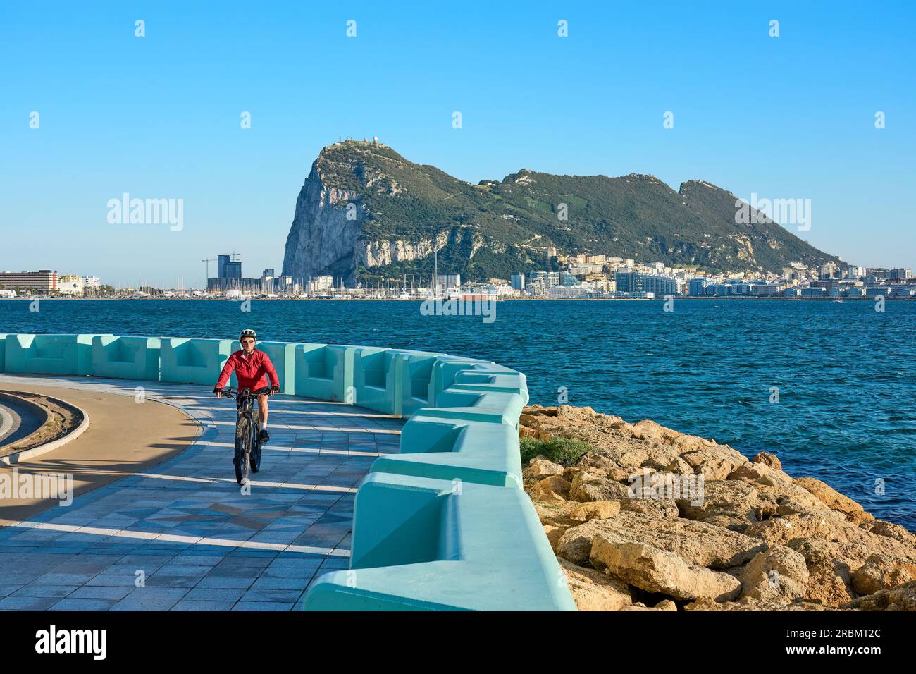 happy senior woman cycling with her electric mountain bike below the ...