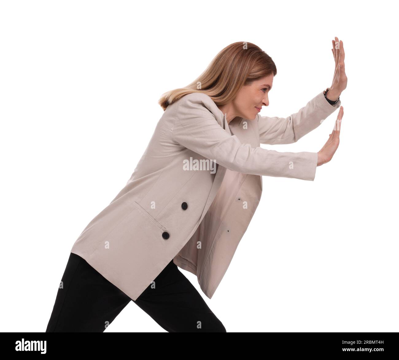 Beautiful businesswoman pushing something on white background Stock ...