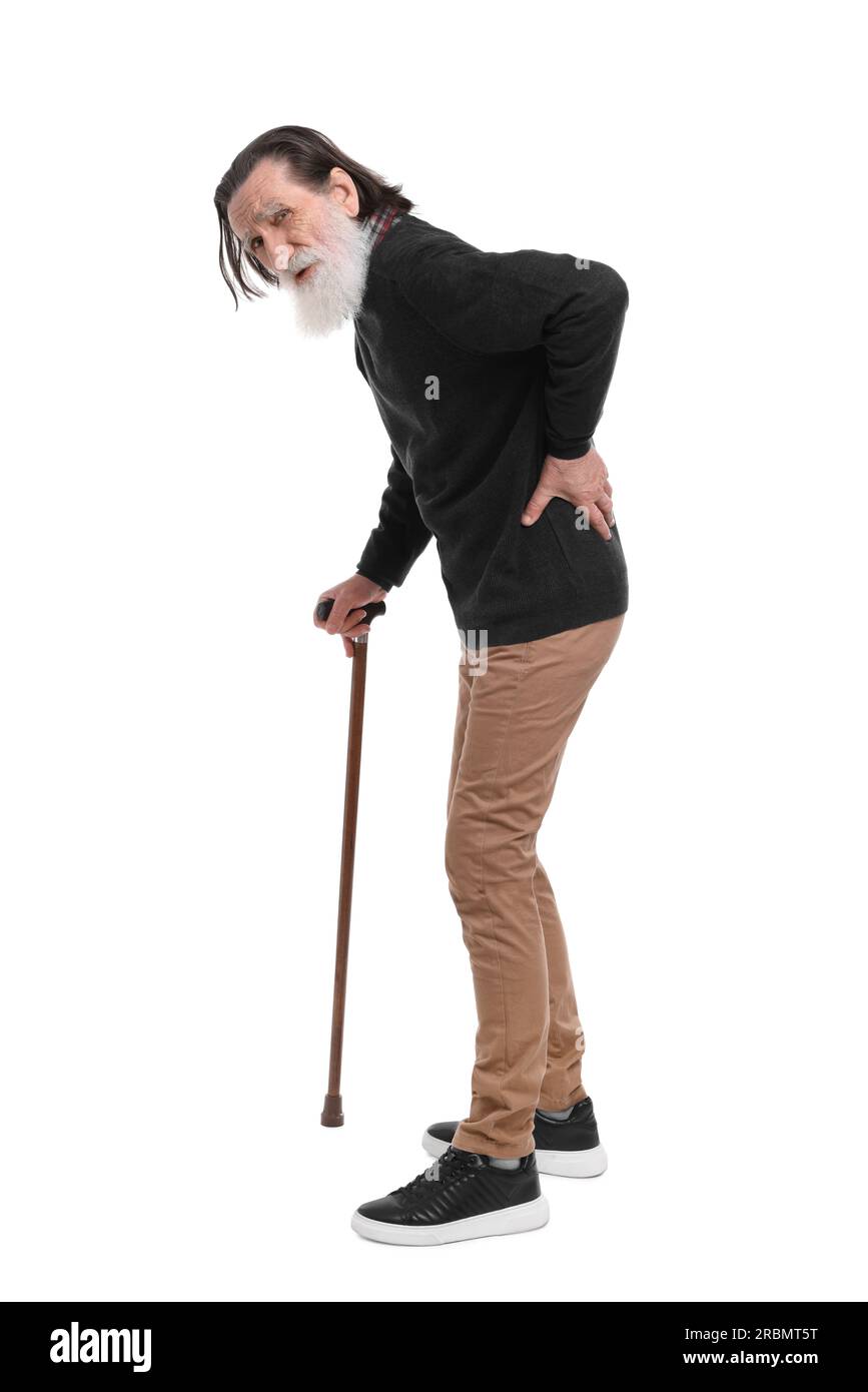 Senior man with walking cane suffering from back pain on white ...