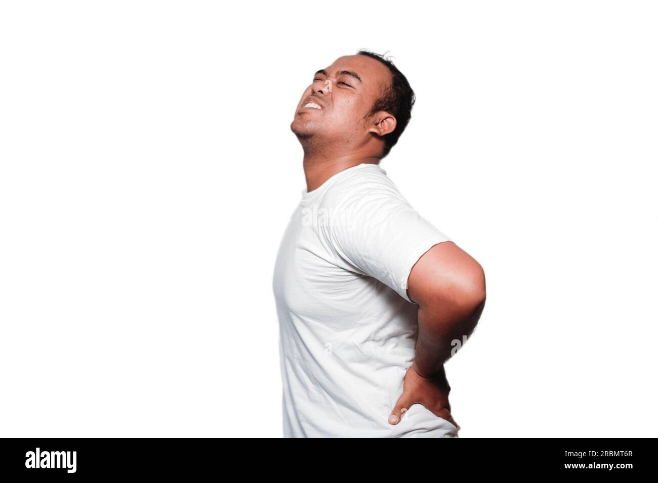 A photo of a Asian man back pain, and shoulder pain wearing a white T ...