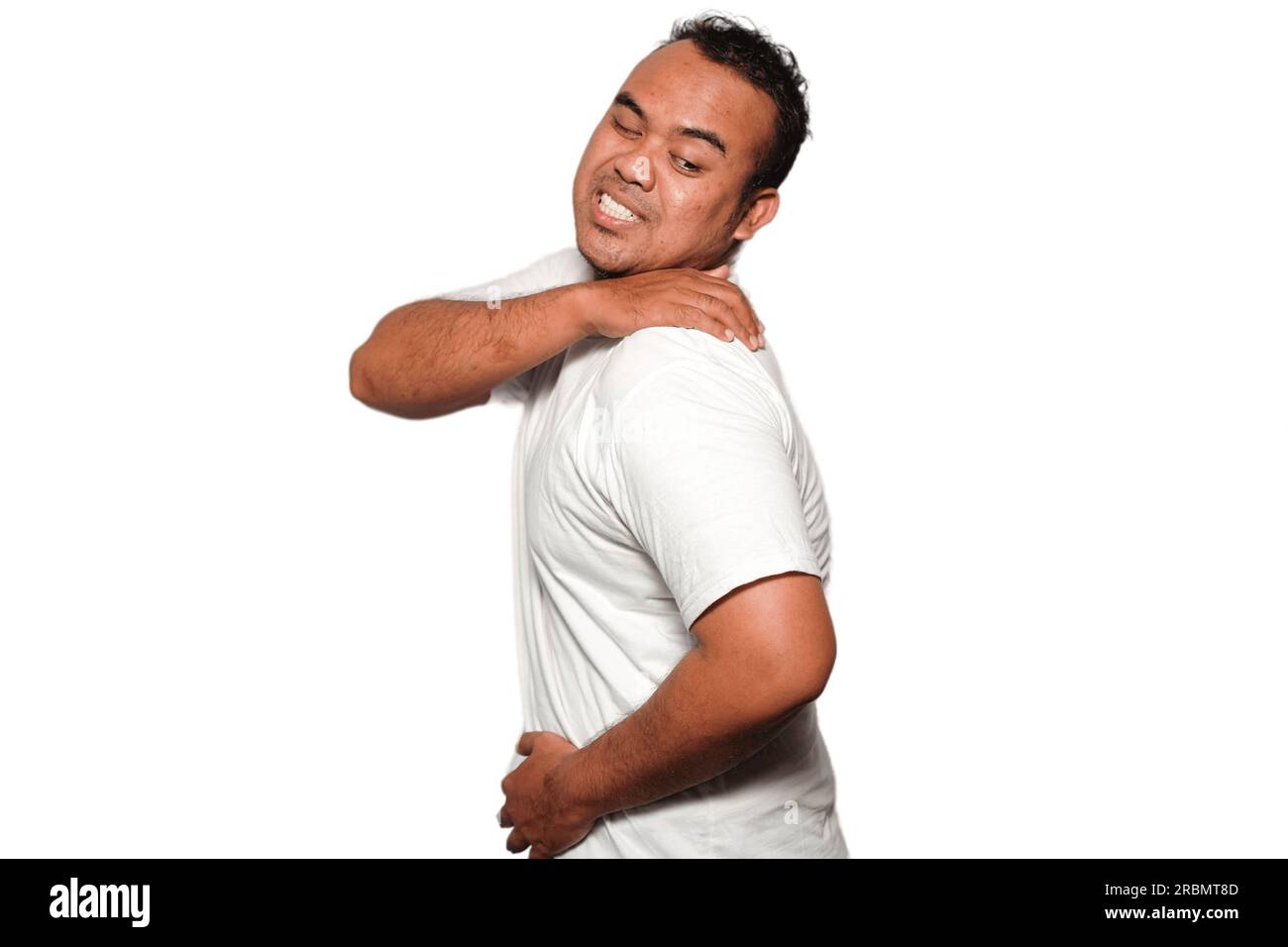 A photo of a Asian man back pain, and shoulder pain wearing a white T ...