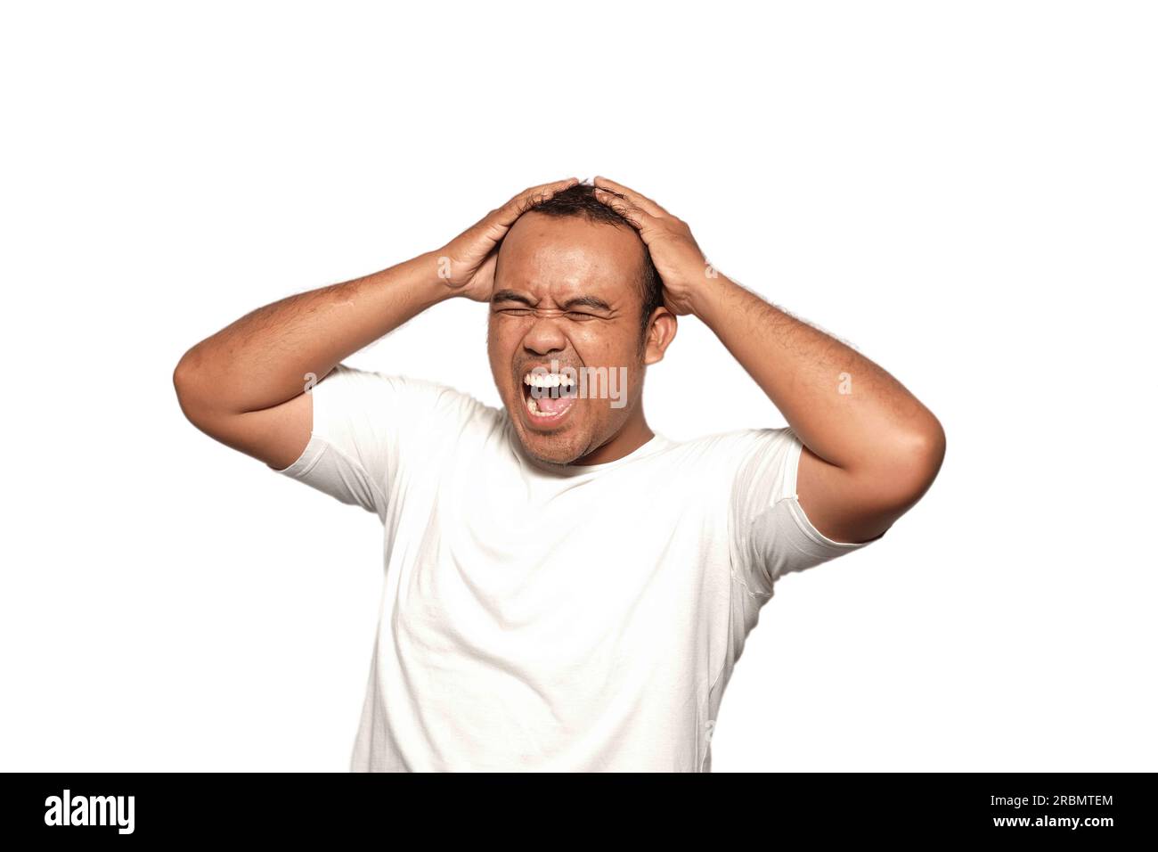 A photo of a Asian man stressed two hands holding stress head wearing a white T-shirt isolated ...