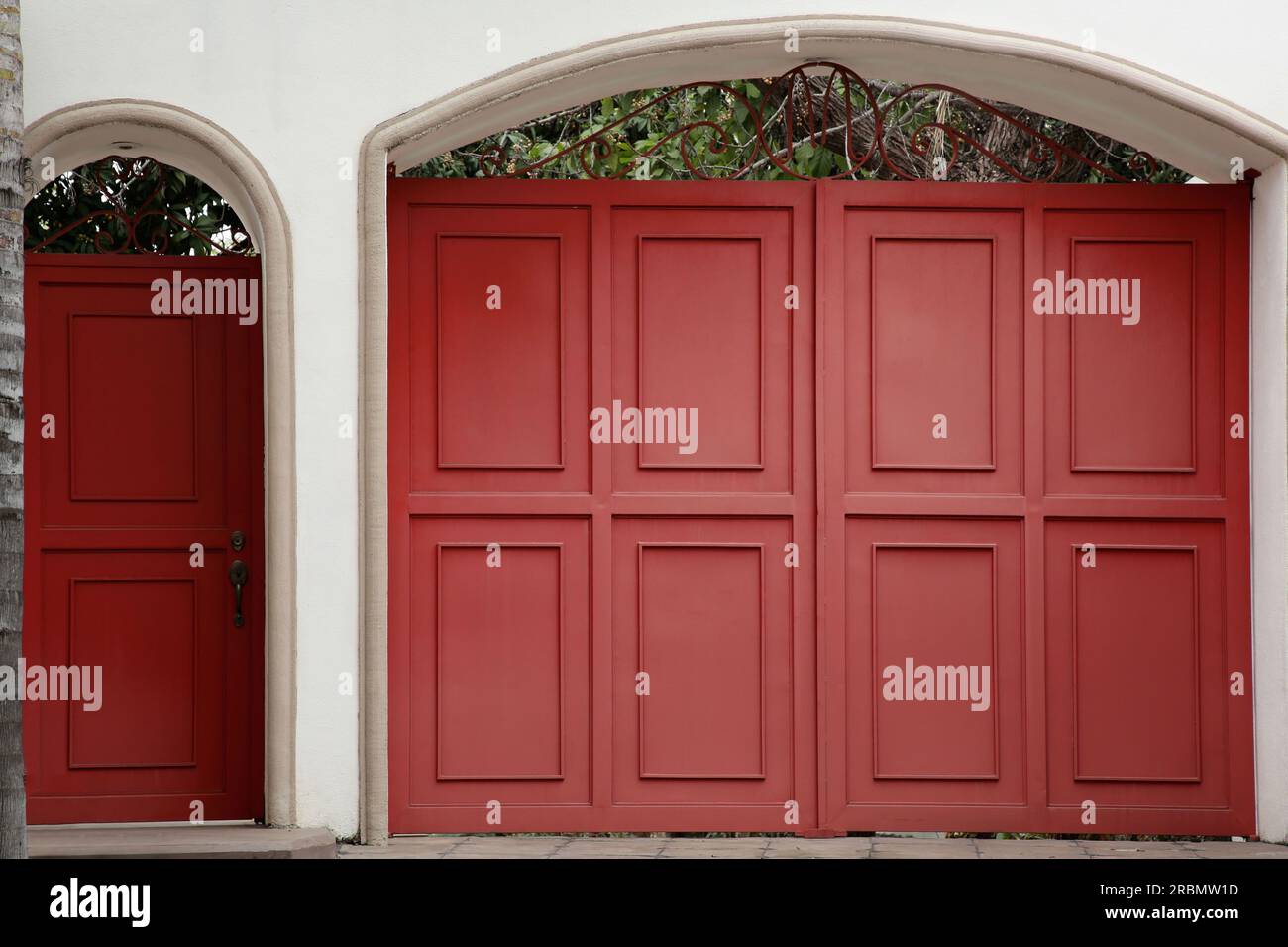 Exterior of building with beautiful wooden gates Stock Photo - Alamy