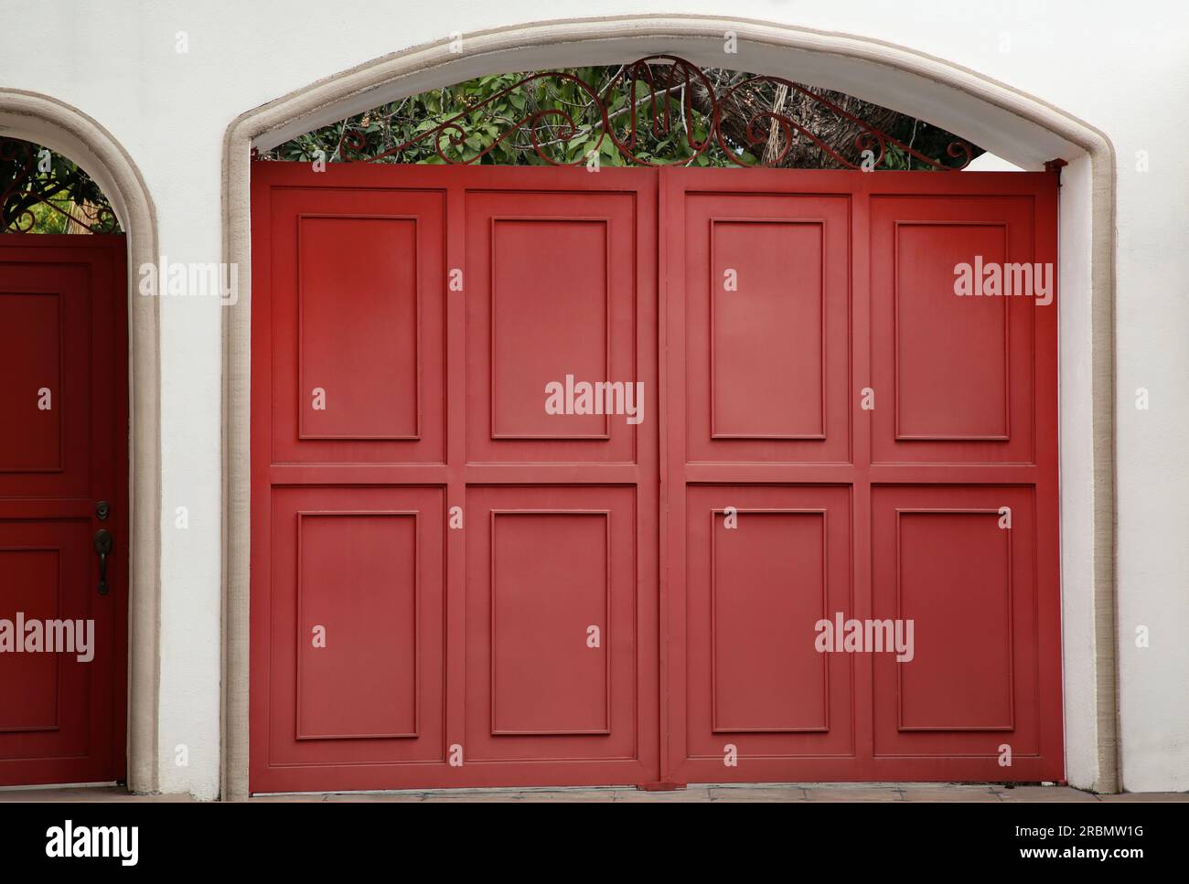 Exterior of building with beautiful wooden gates Stock Photo - Alamy