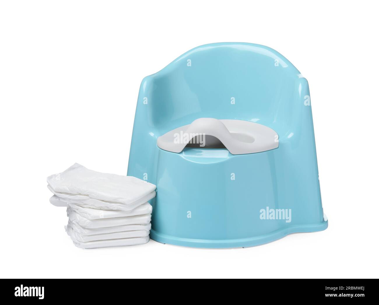 Light blue baby potty and stack of diapers isolated on white. Toilet ...