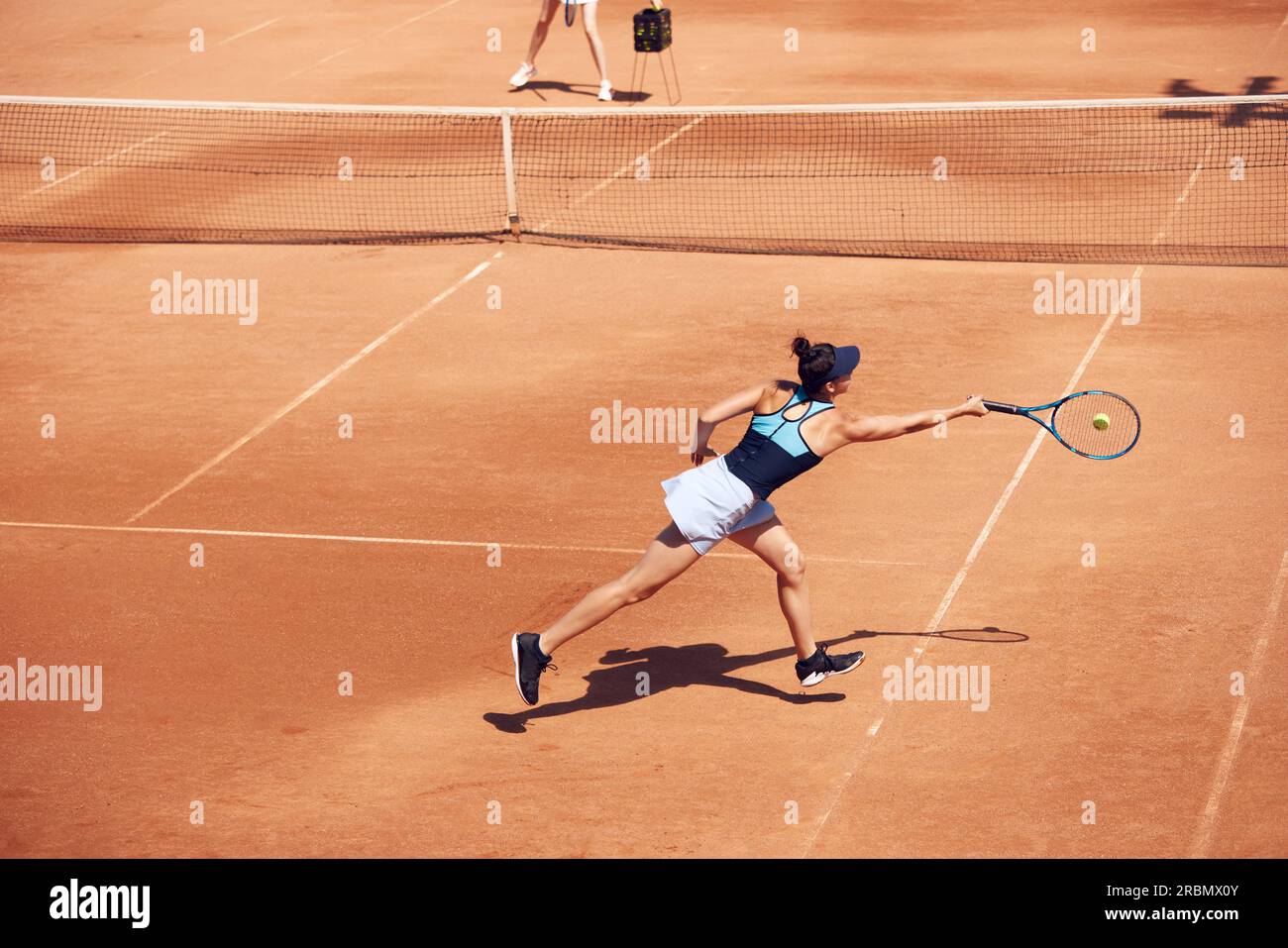 Top view image of young woman, tennis player in motion during game ...