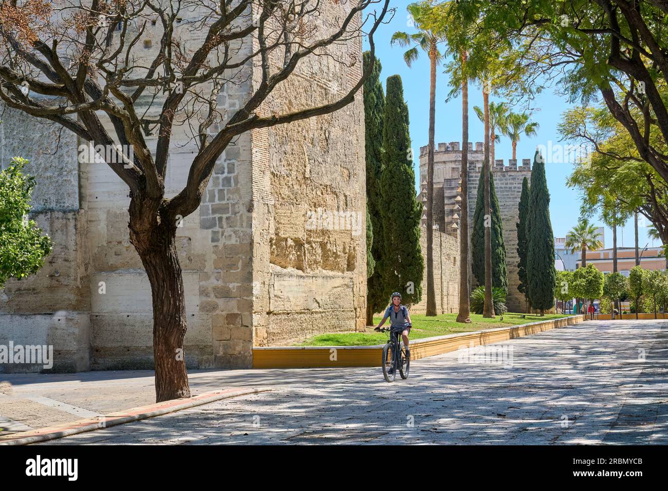 nice, active senior woman cycling with her electric mountain bike in ...