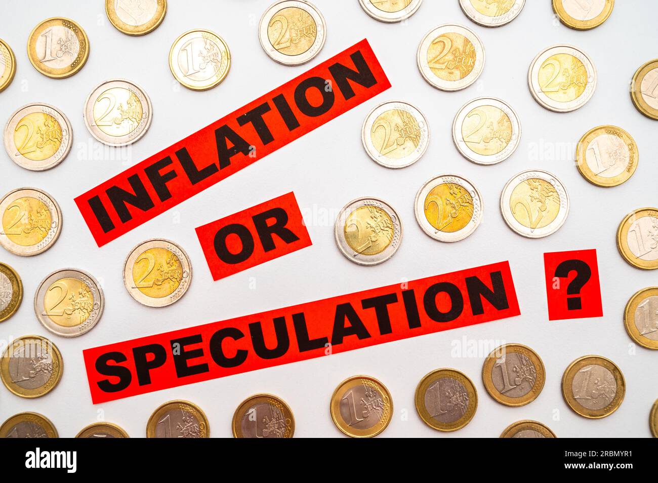 Coins placed next to each other on white surface and text "inflation or ...