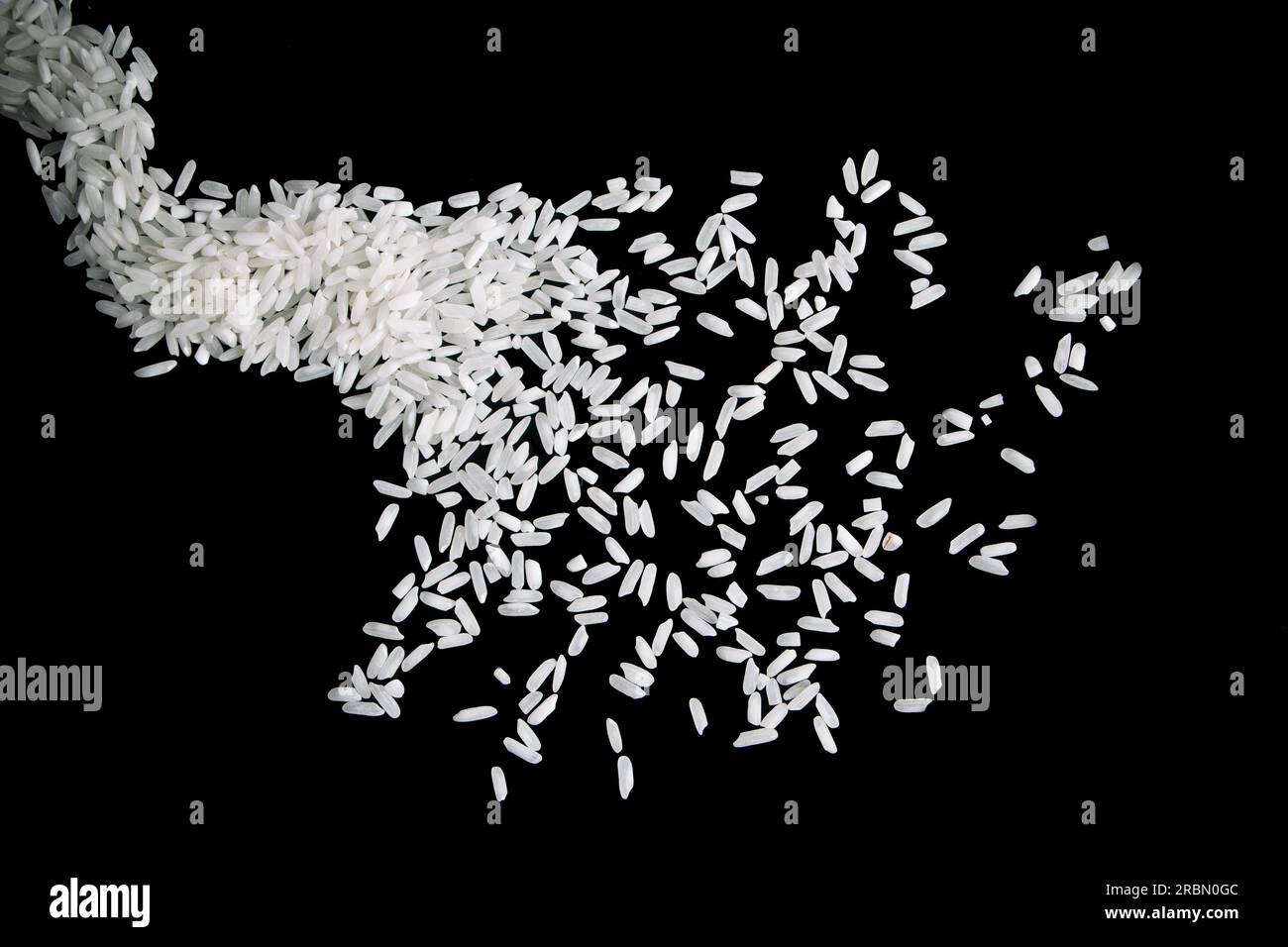 Raw white rice splash on black background. Uncooked rice explosion ...