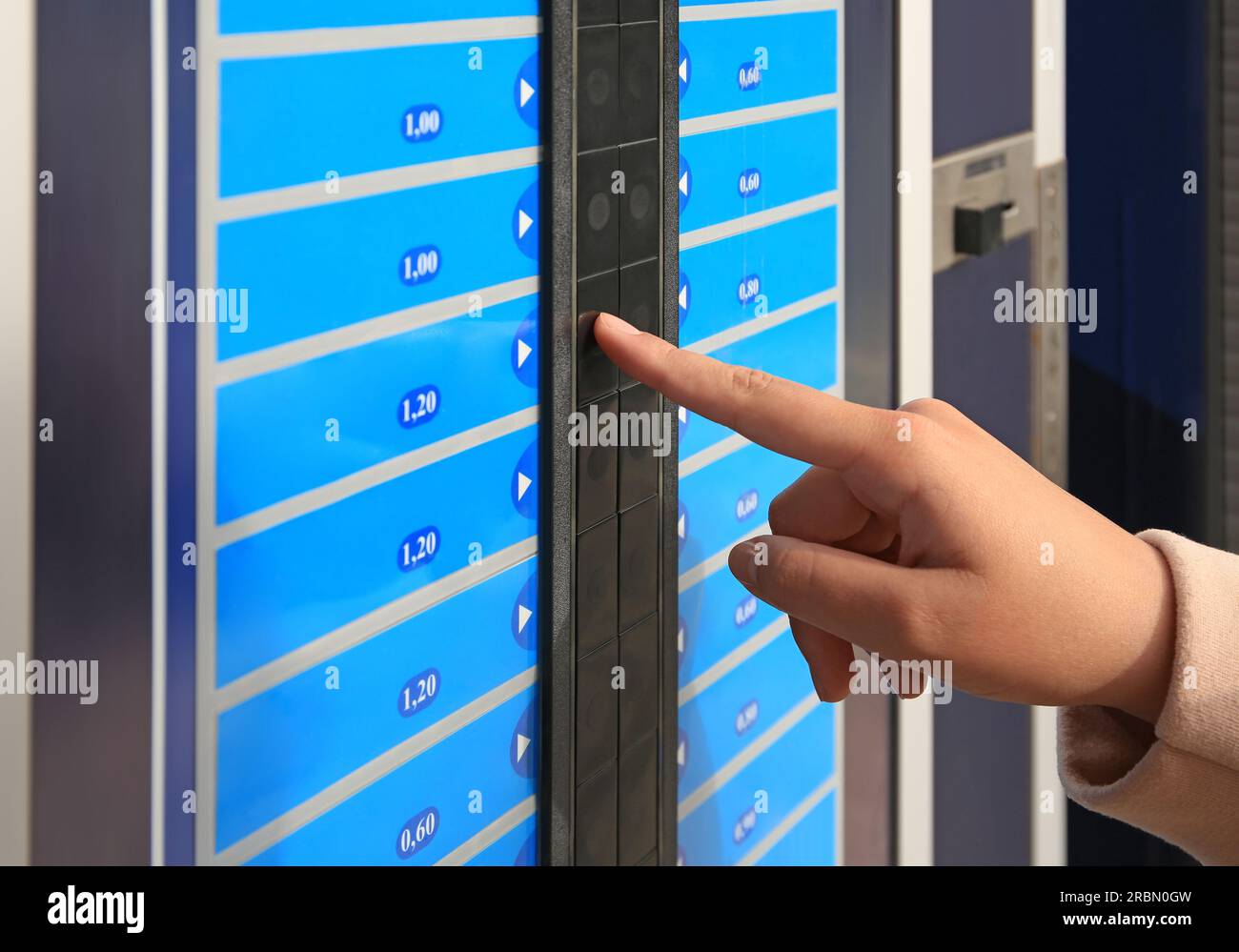 Using coffee vending machine. Woman pressing button to choose drink ...