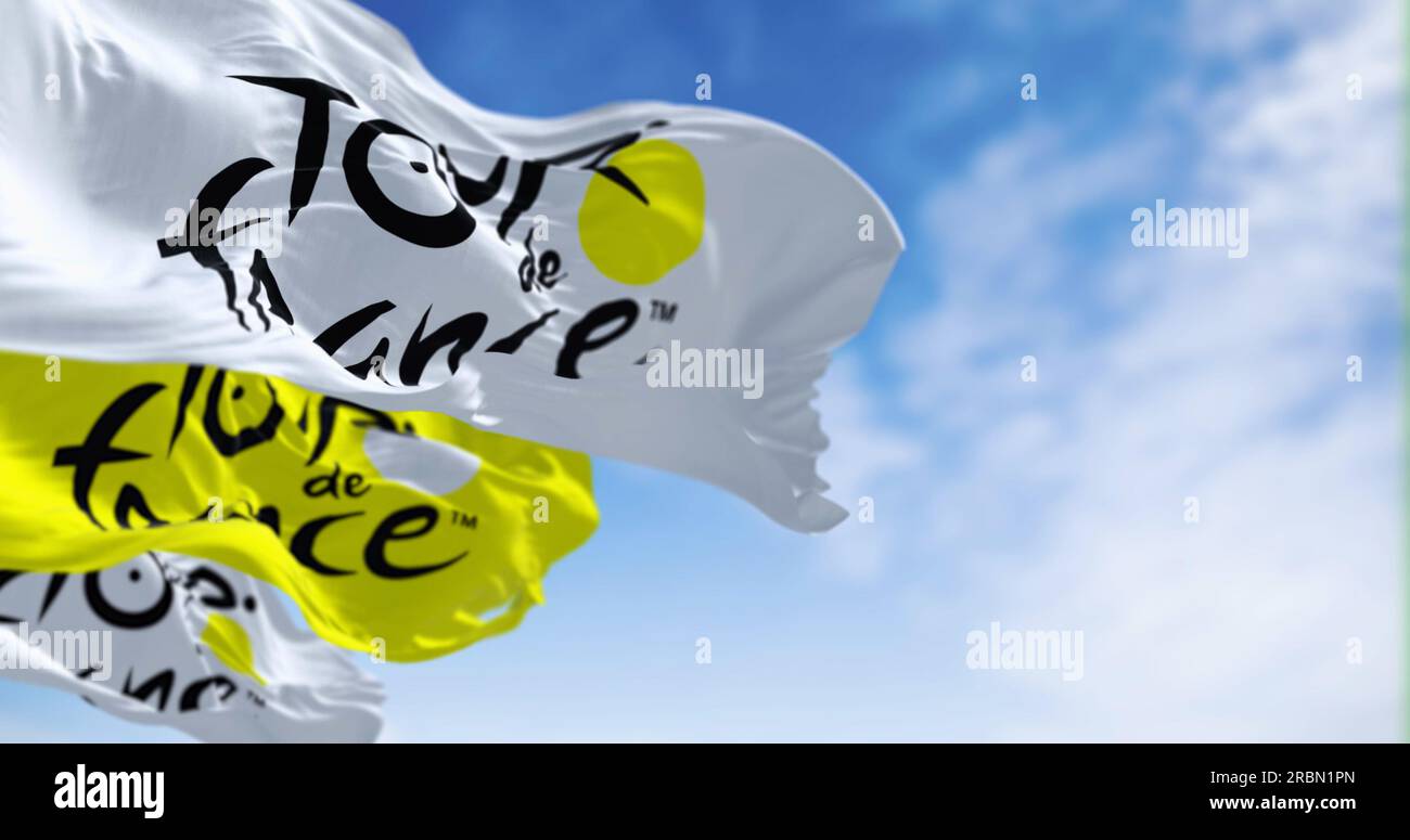 Paris, FR, June 26 2023: Tour de France flags waving. Most important ...