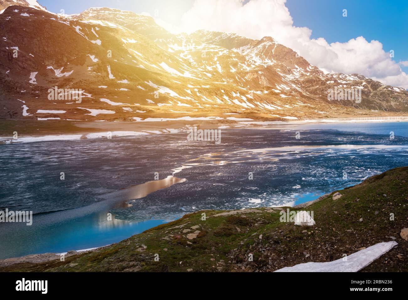 Lake in Switzerland in spring with some ice, alps landscape Stock Photo ...
