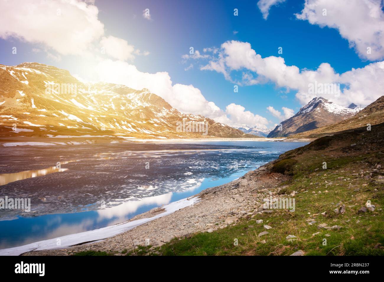 Lake in Switzerland in spring with some ice, alps landscape Stock Photo ...