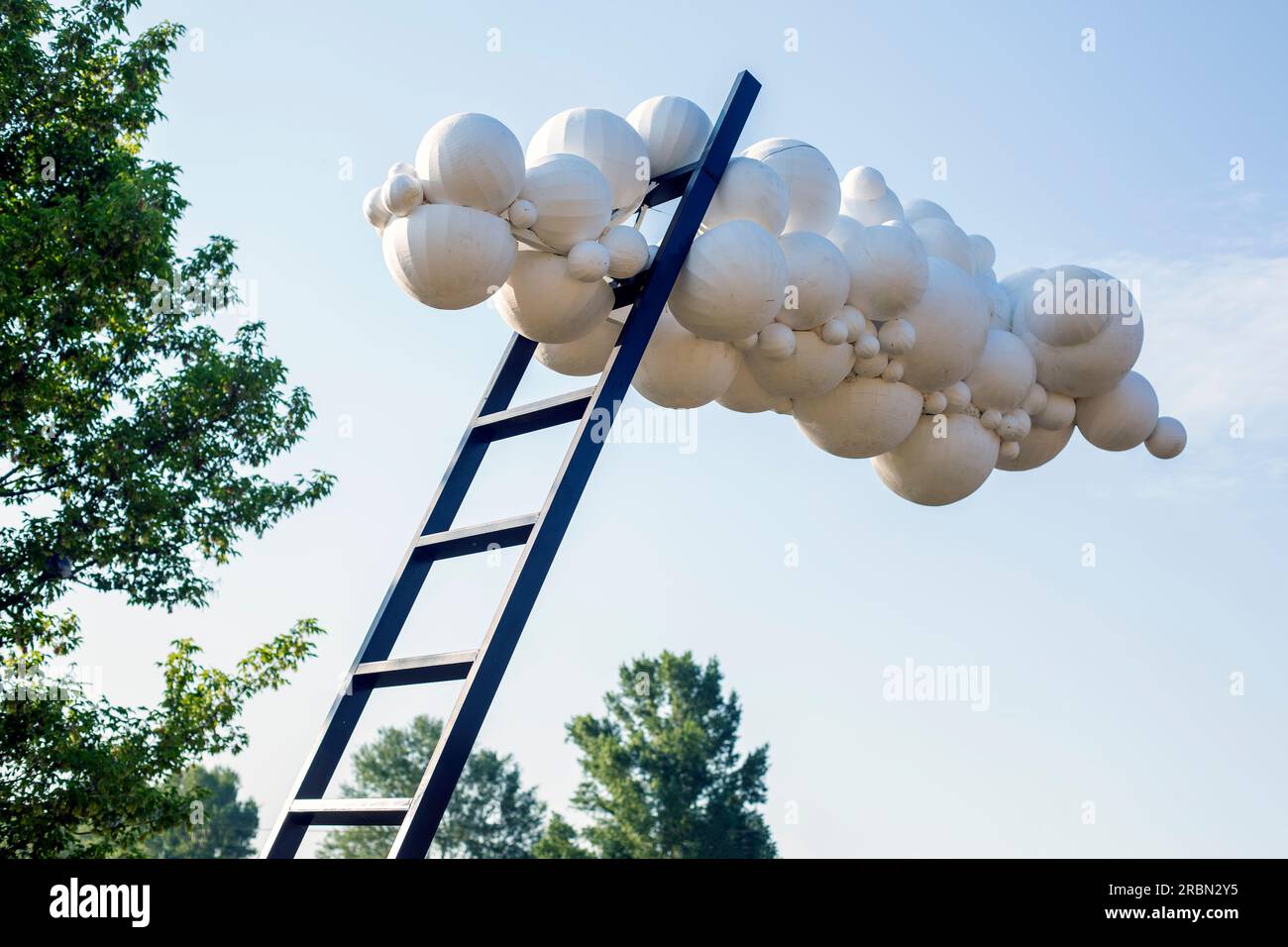 Artistic object - a ladder resting on an artificial cloud made of ...