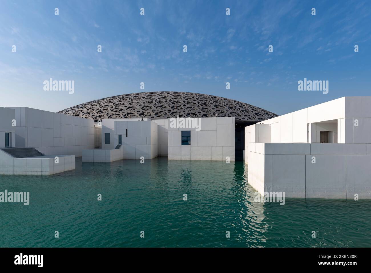 The Louvre Abu Dhabi showcases a magnificent facade harmoniously ...