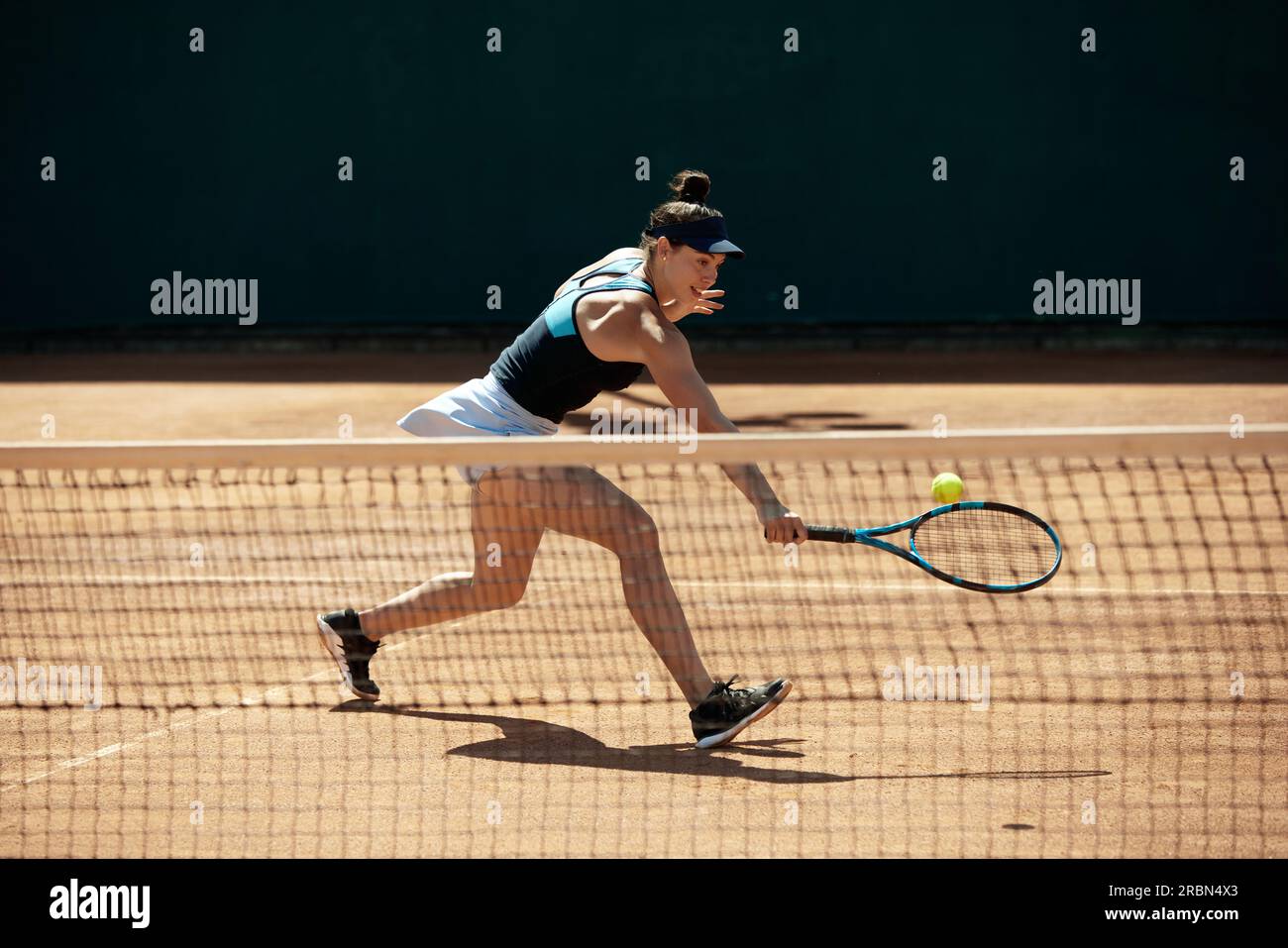 Dynamic image of young woman, professional tennis player in motion ...