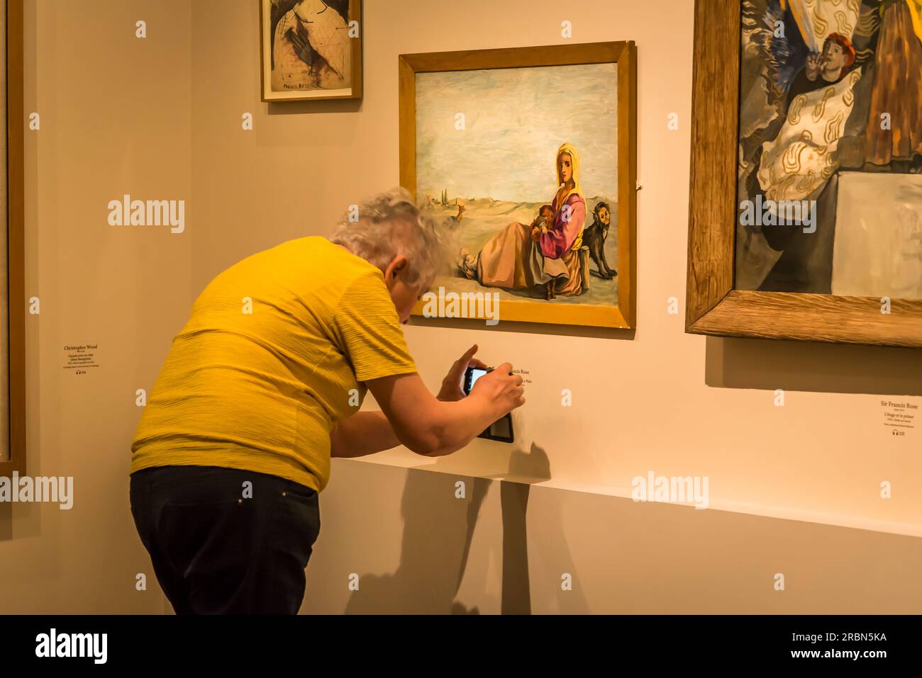 Woman taking picture of a painting title, Neo-romantics exhibition ...