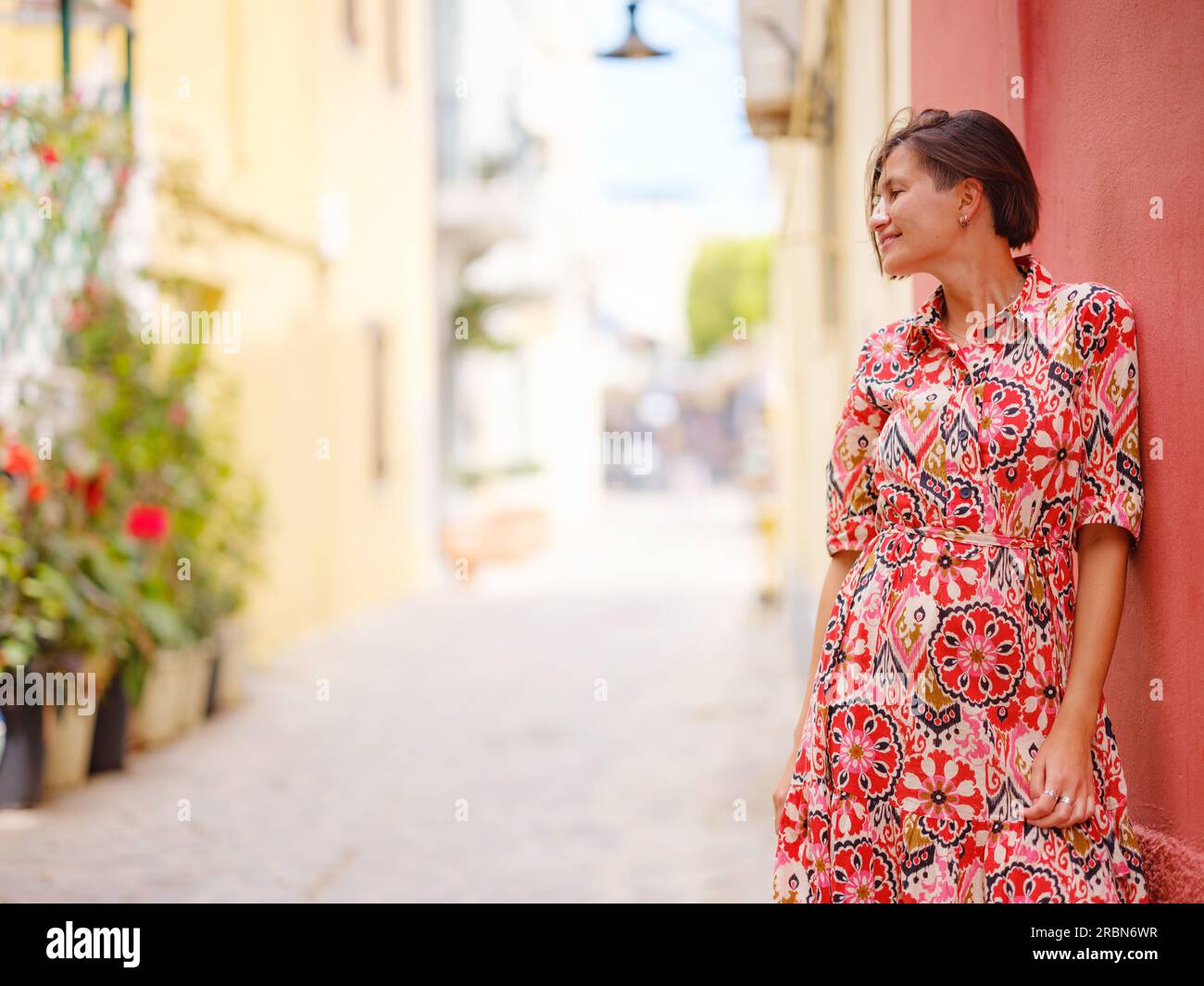 summer trip to Rhodes island, Greece. Young Asian woman in ethnic red ...