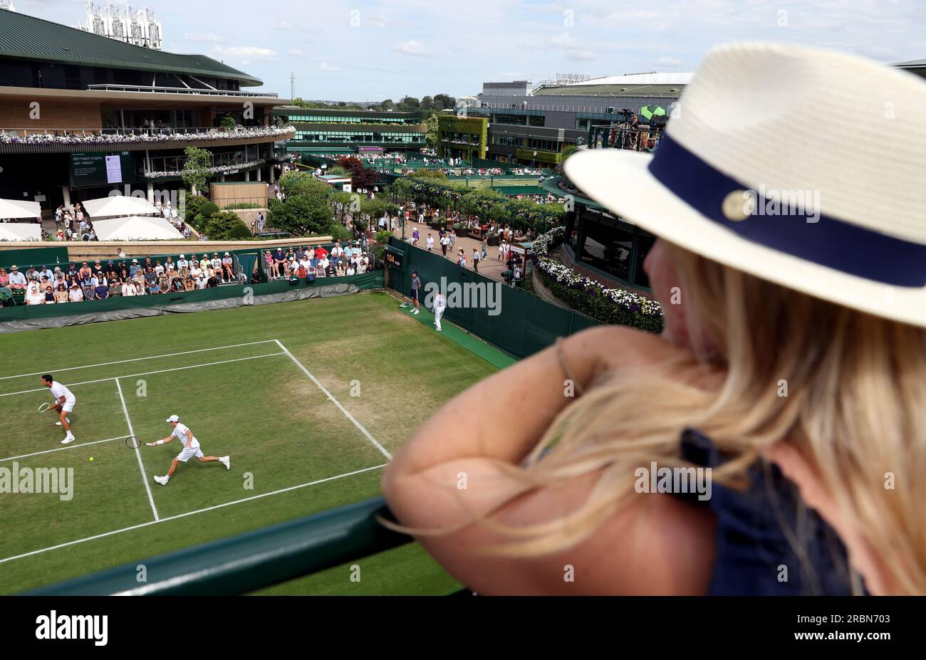 A spectator watches the action on court 18 on day eight of the 2023 ...