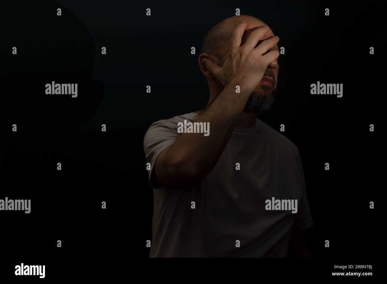 Sad man suffering from headache or migraine. Stressed guy with painful ...