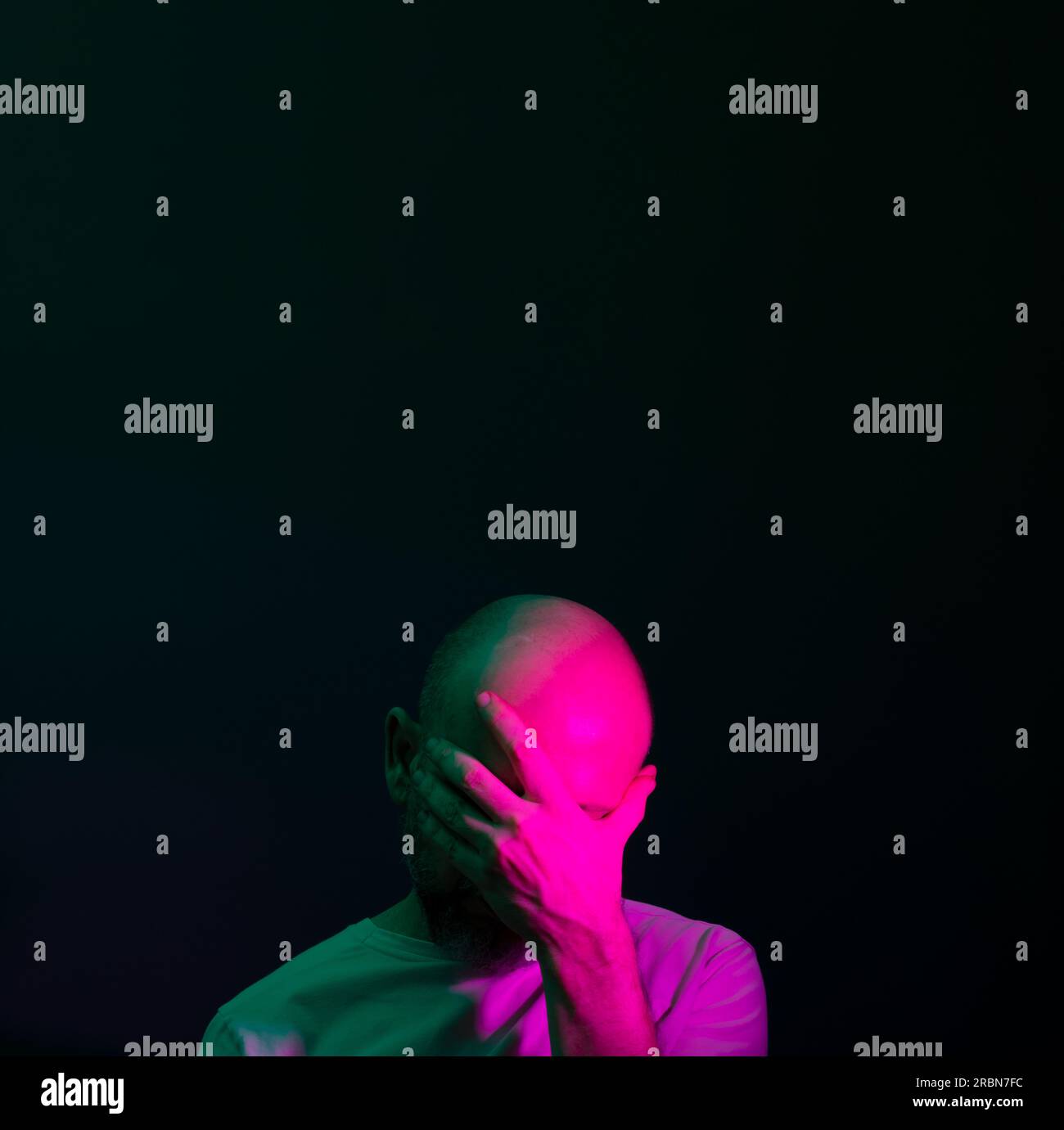 Sad man suffering from headache or migraine. Stressed guy with painful ...