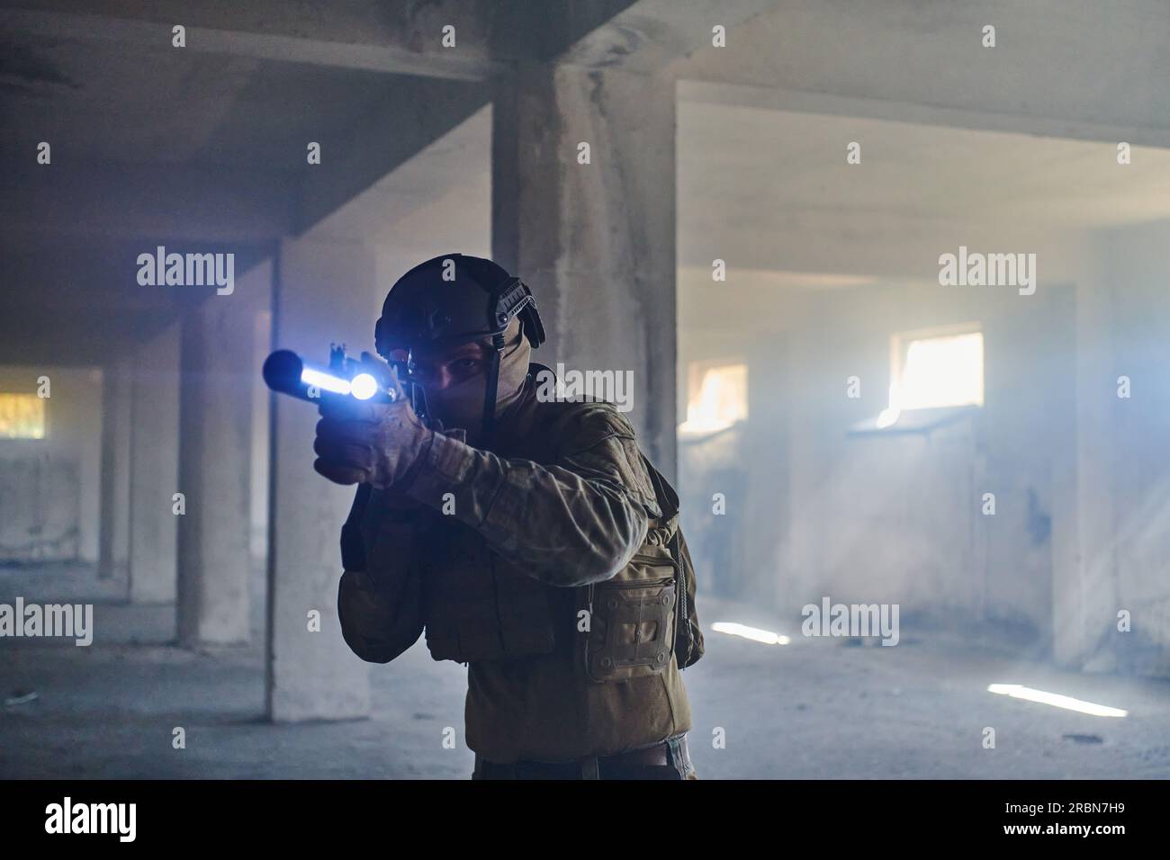 A professional soldier in an abandoned building shows courage and ...