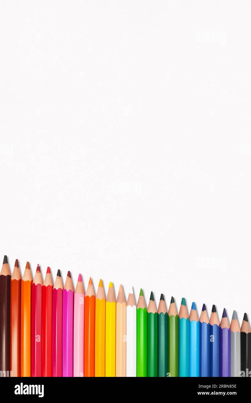 Crayons in line on a blank sheet of paper Stock Photo - Alamy