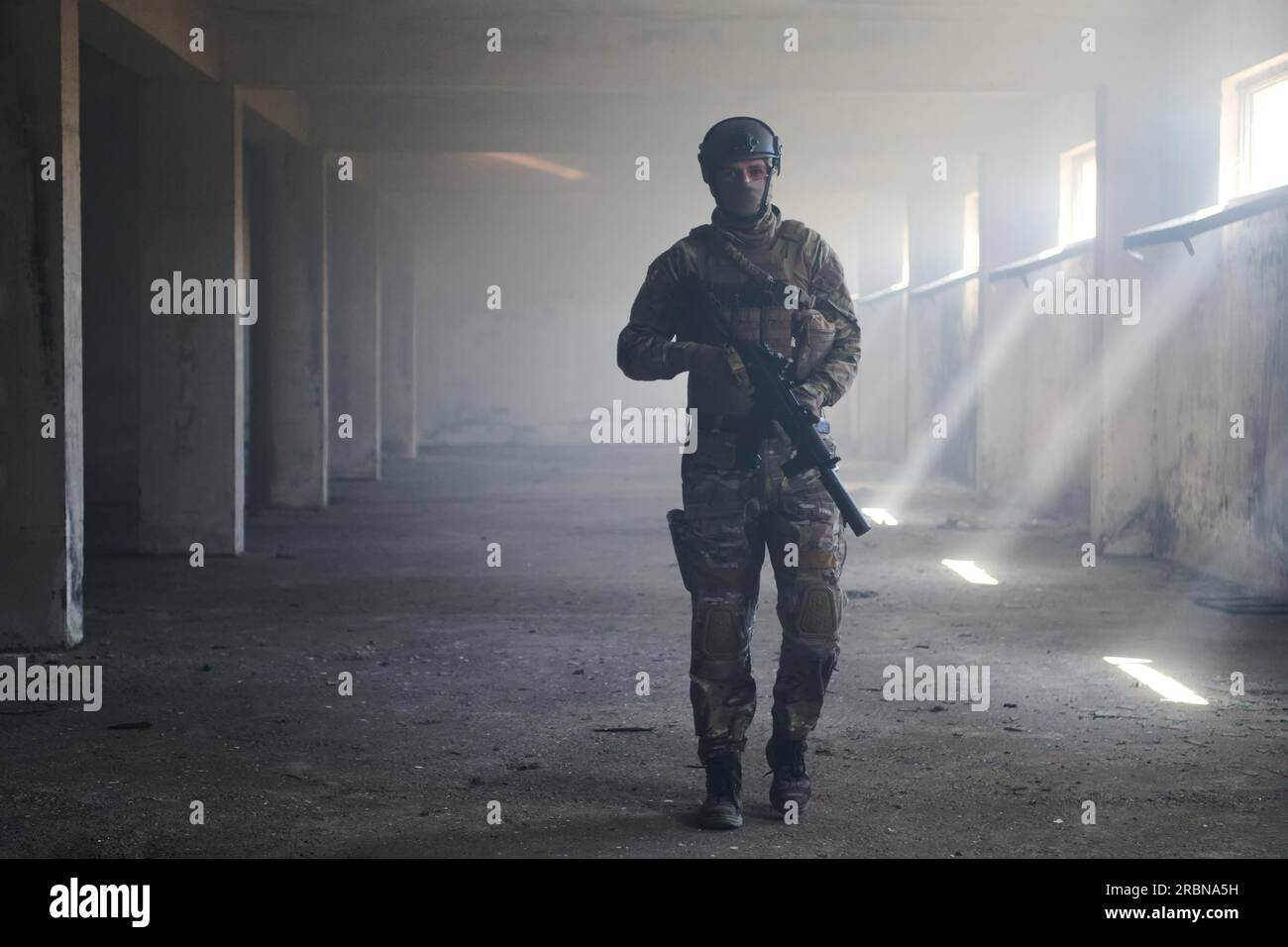 A professional soldier in an abandoned building shows courage and ...