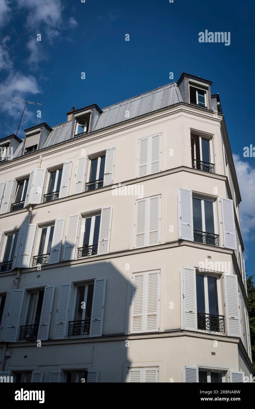 White apartment building with venetian window blinds, Paris, France ...