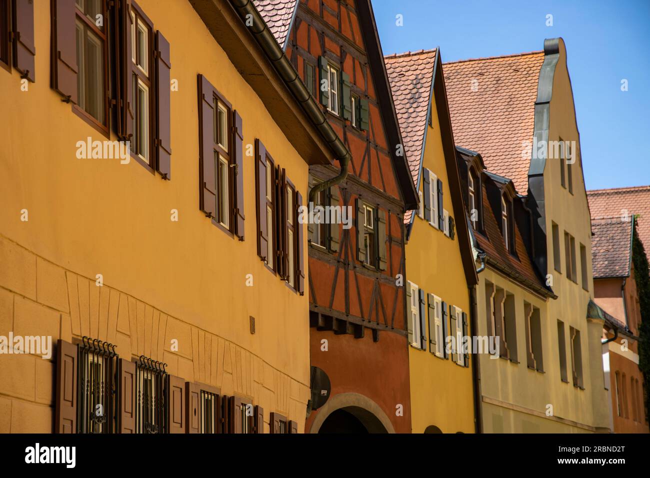 Reflected yellow light saturates the yellow color on buildings in the ...