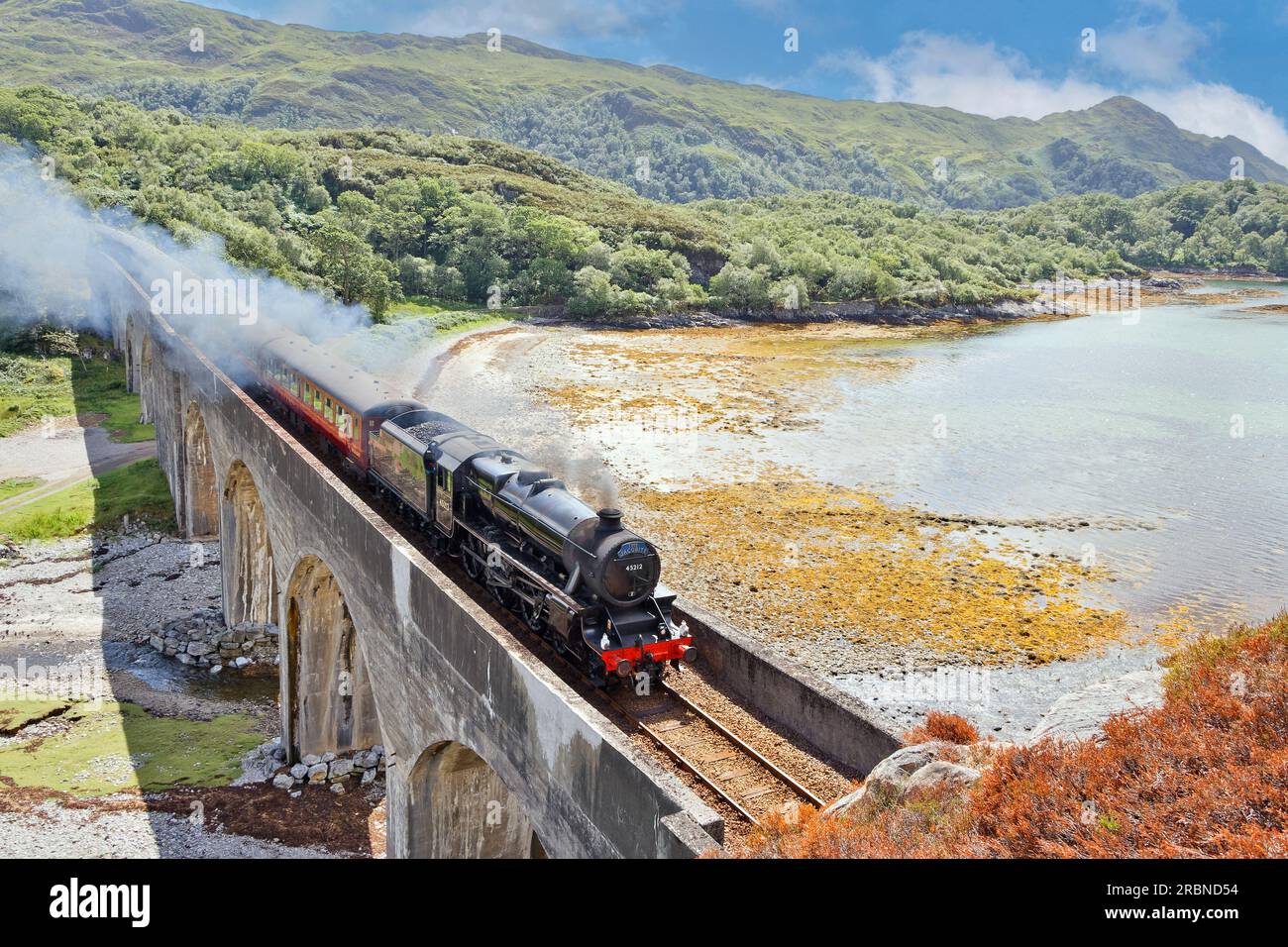Jacobite Steam Train on the rail line over the nan Uamh Railway Viaduct ...