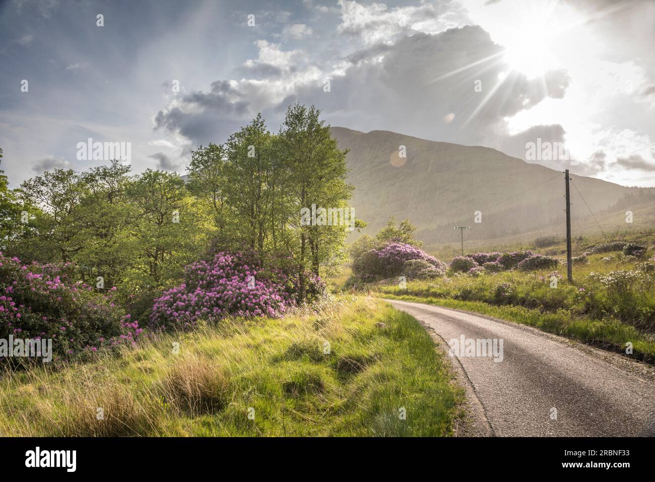 Country road with rain showers in Glen Etive, Highlands, Scotland, UK ...