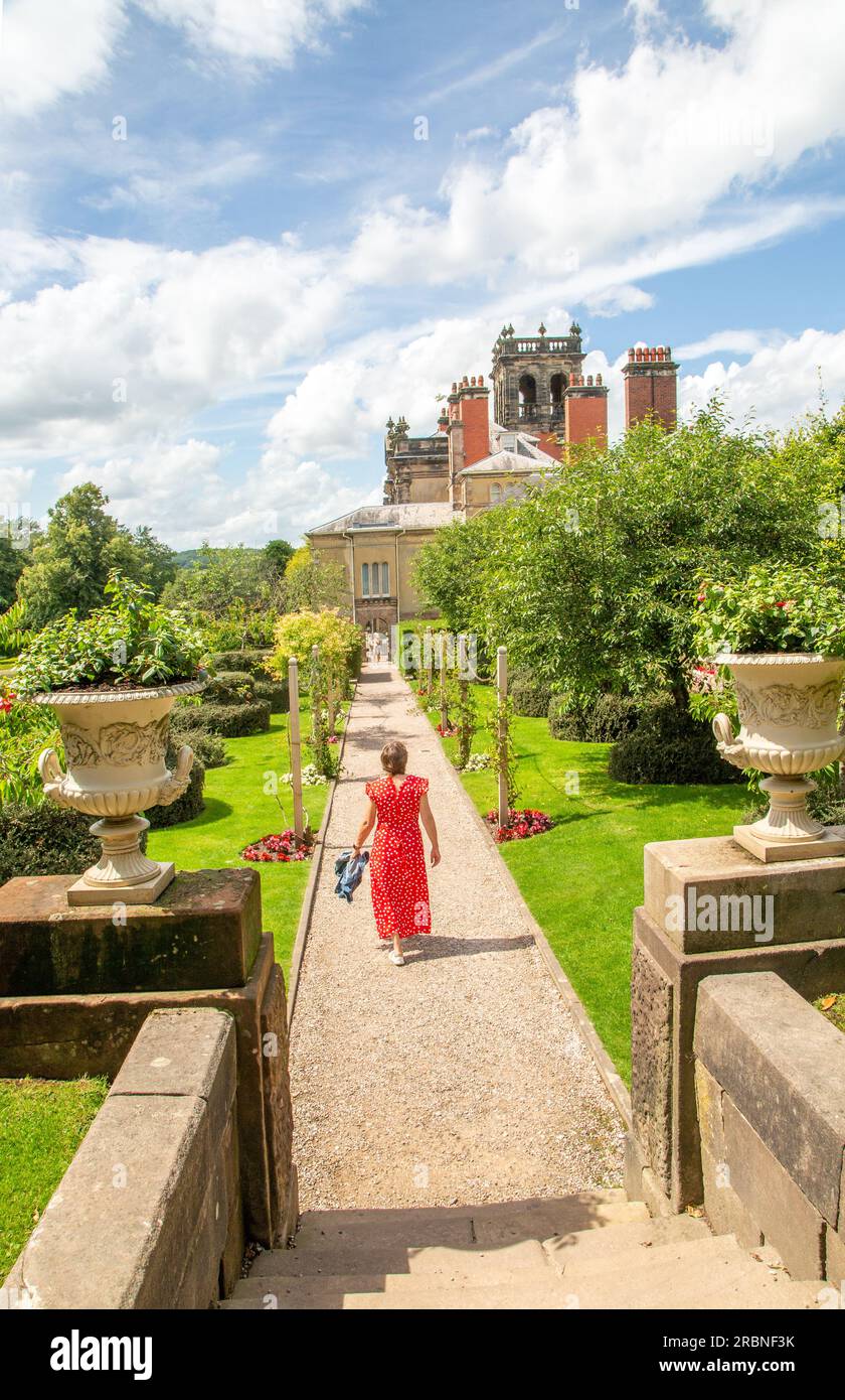 Woman walking in the grounds of the National trust Biddulph Grange ...
