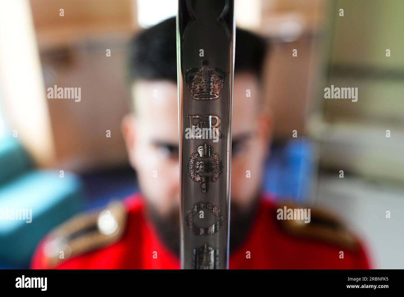 Ens. Jean Murad displays his sword as the Canadian Grenadier Guards (CGG) regiment prepare for ...