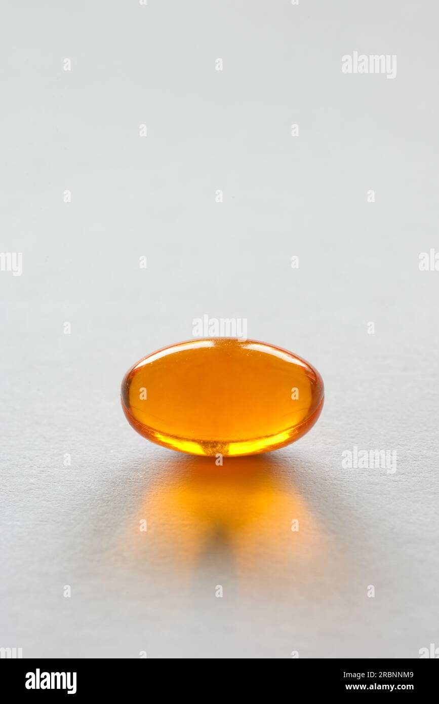 Detail of orange pills in packaging and isolated for healthcare Stock ...